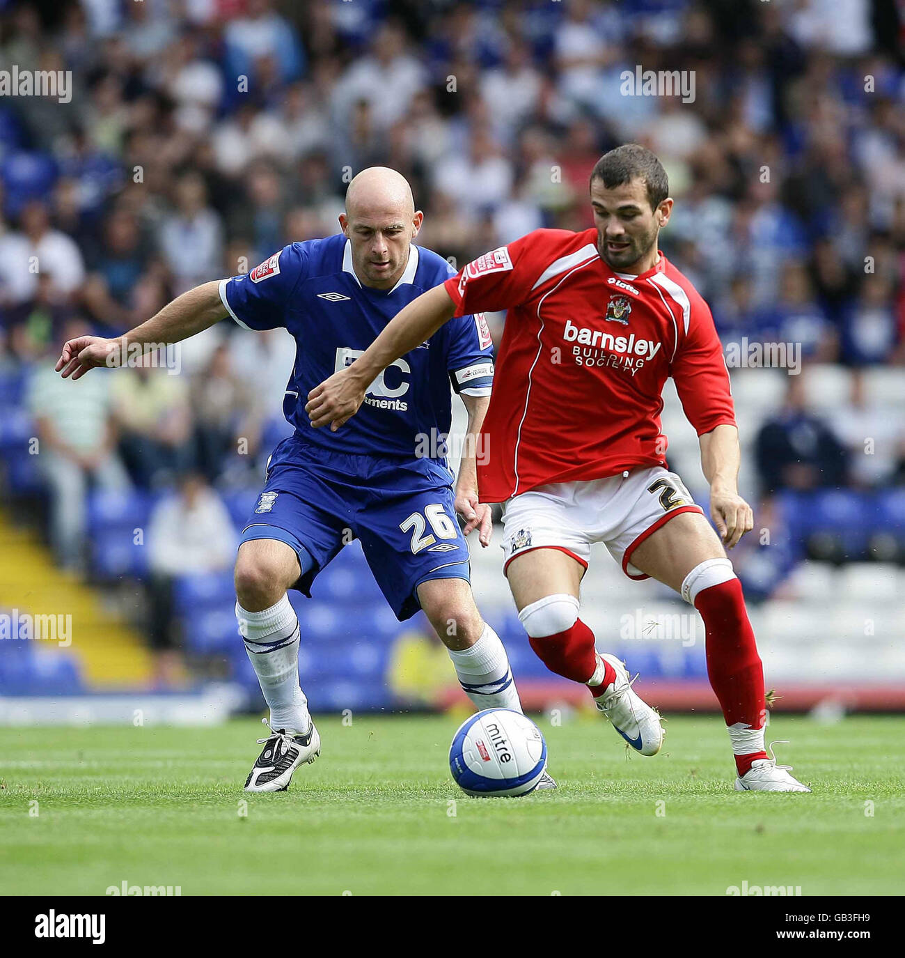 Birmingham City's Lee Carsley (left) and Barnsley's Martin Devaney ...