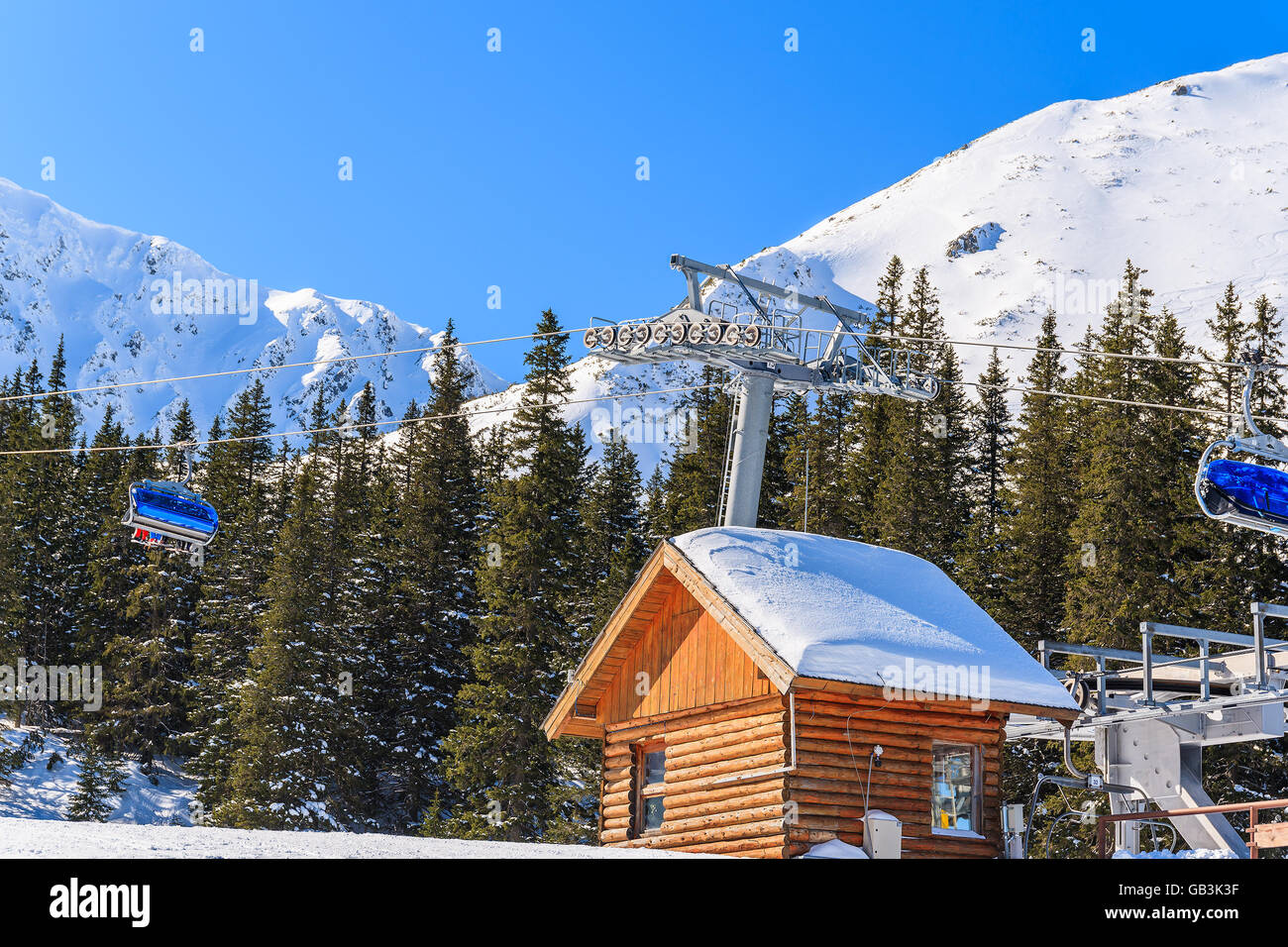Small wooden hut on ski slope in Rohace winter resort, Tatra Mountains ...