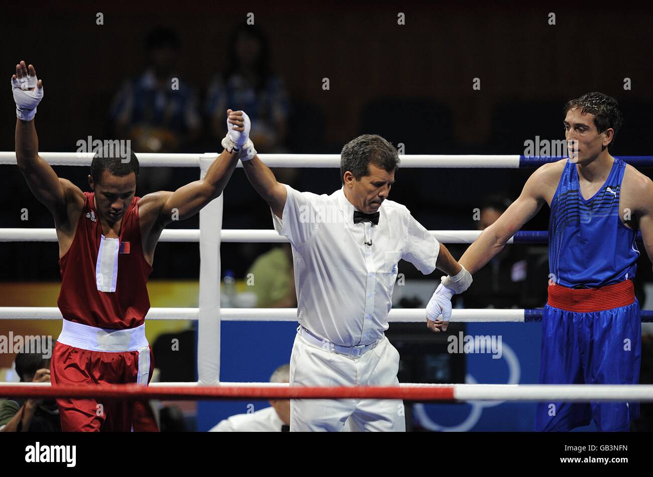 Munkh-Erdene Uranchimeg of Mongolia, red, celebrates after defeating ...