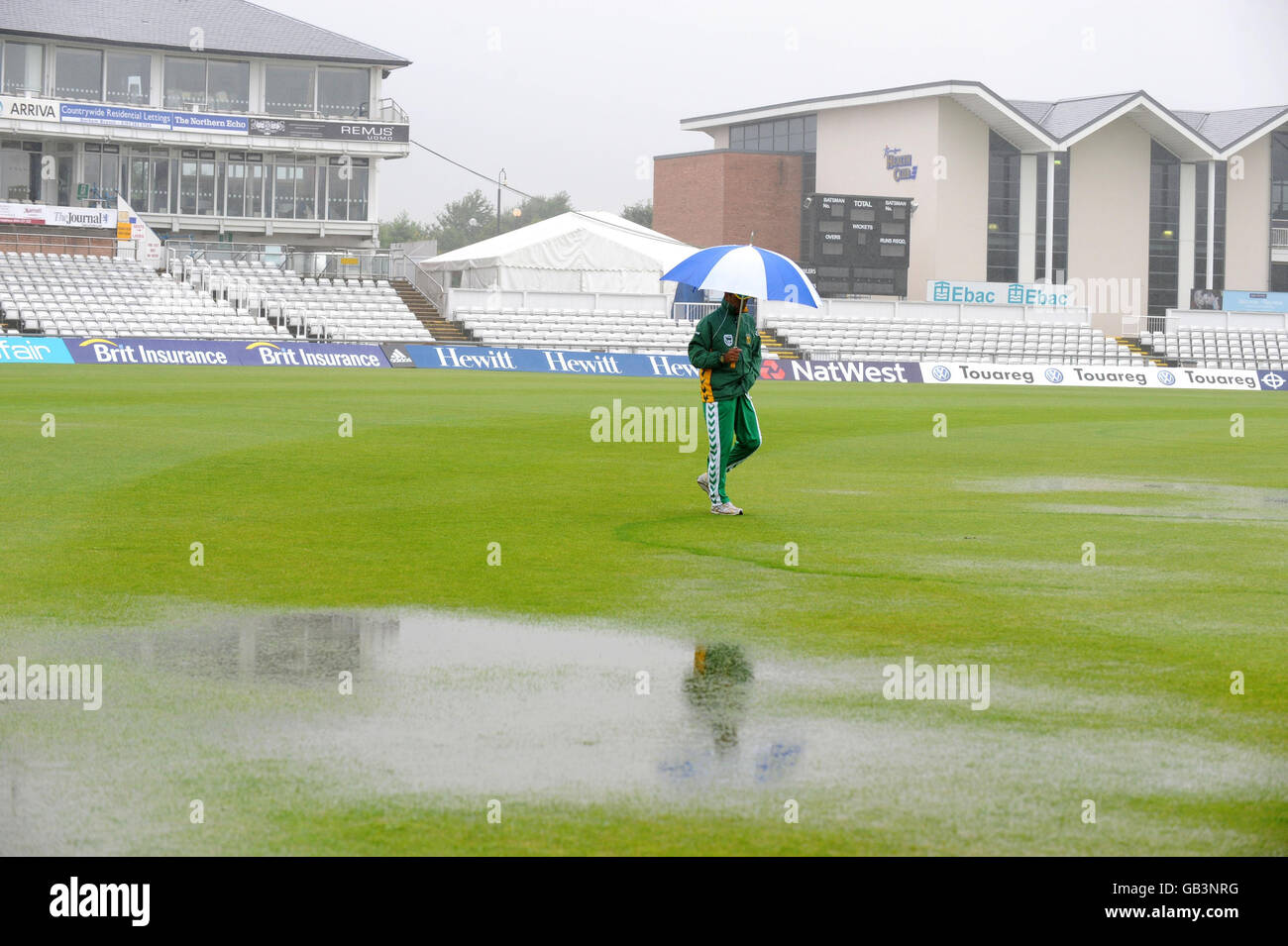 South Africa coach Vincent Barnes takes a look at the waterlogged pitch ...