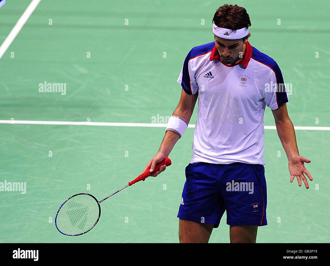 British badminton Nathan Robertson appears frustrated during the mixed ...