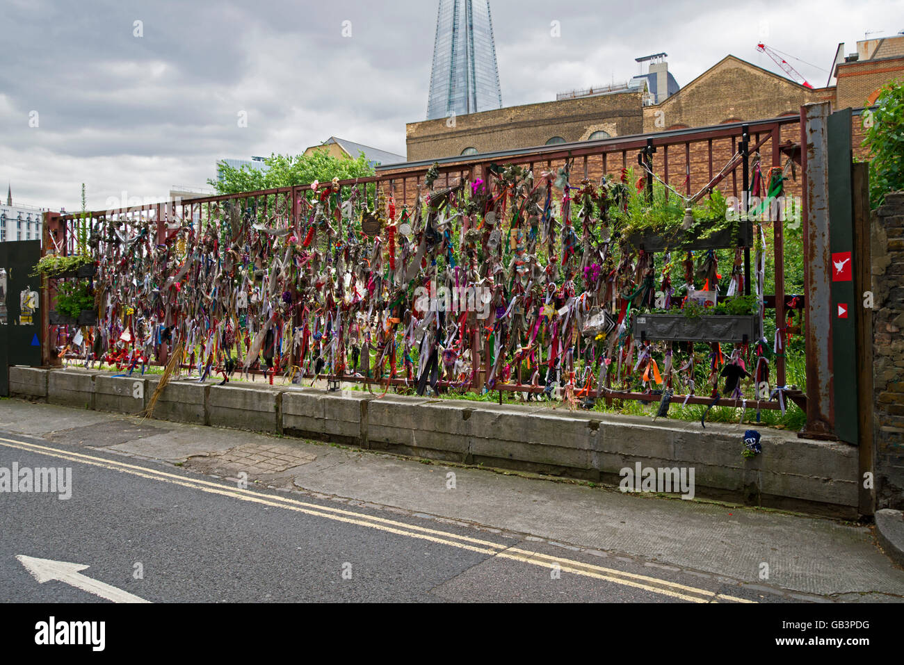Tokens of remembrance tied to the railings of Crossbones Paupers ...