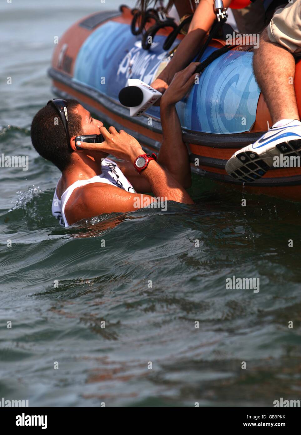Israel's Shahar Zubari is interviewd whilst on the phone in the water ...
