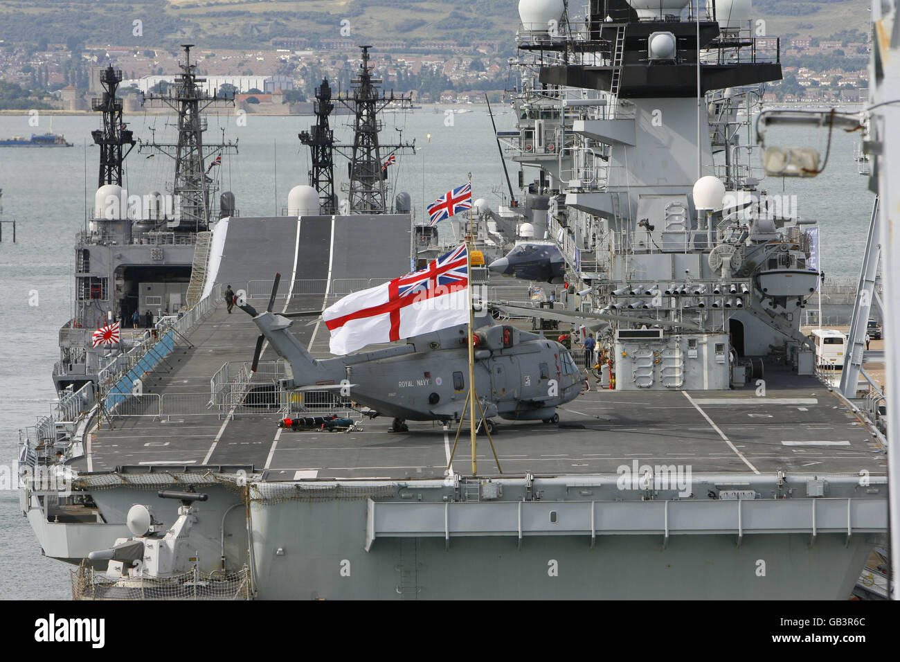A Merlin helicopter on the flight deck of HMS Illustrious at the Royal ...