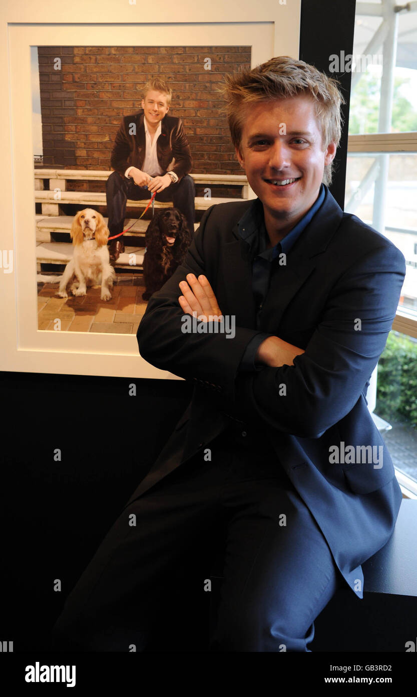 Jonathan Ansell is seen with his portrait from the new PDSA Pet ...