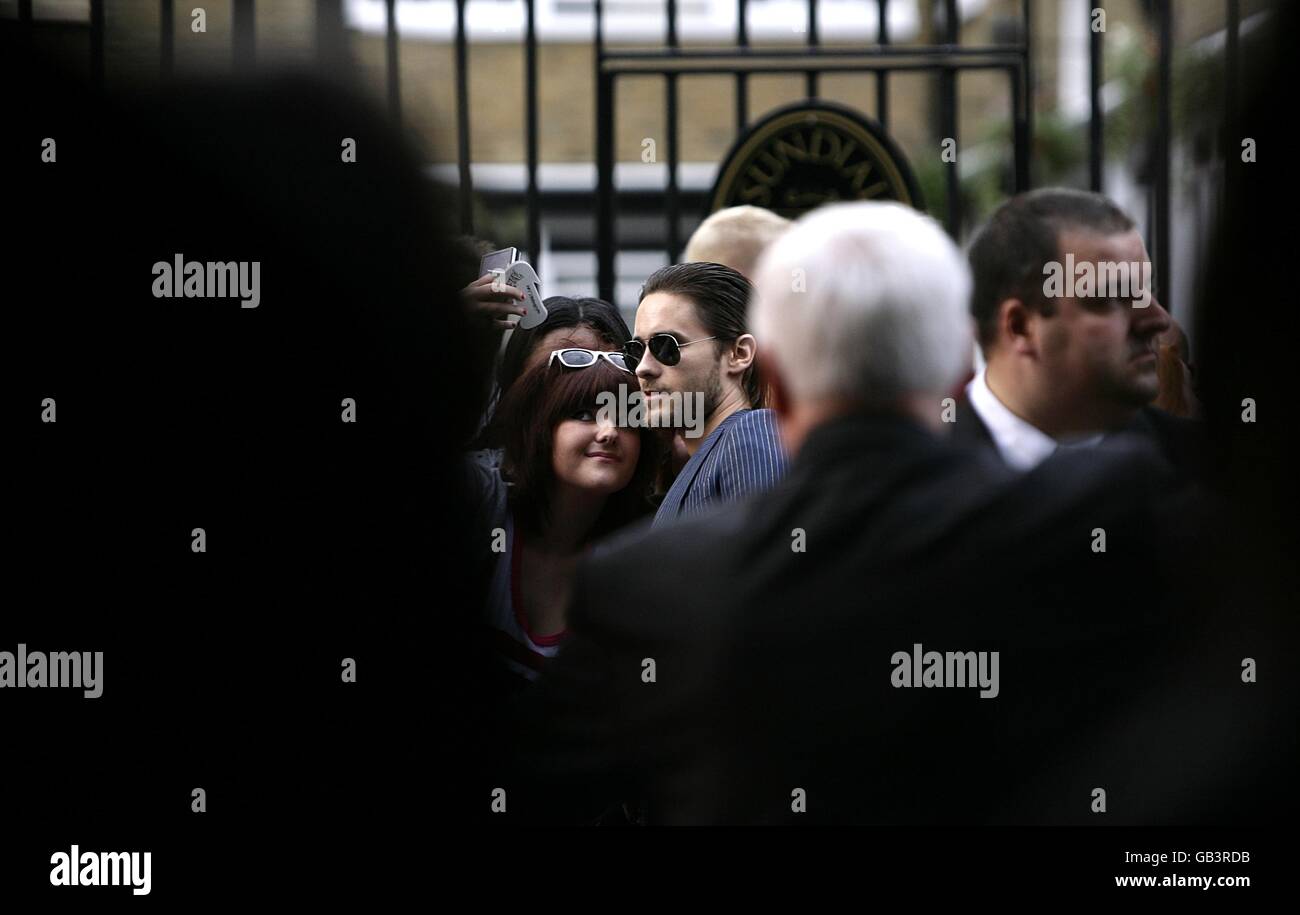 Jared Leto of 30 Seconds to Mars poses for photographs with fans as he ...