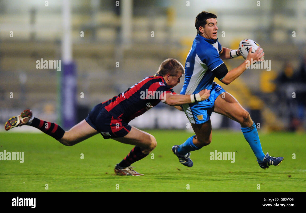 Hull FC's Mike Mitchell is tackled by Wakefield's Aaron Murphy during ...