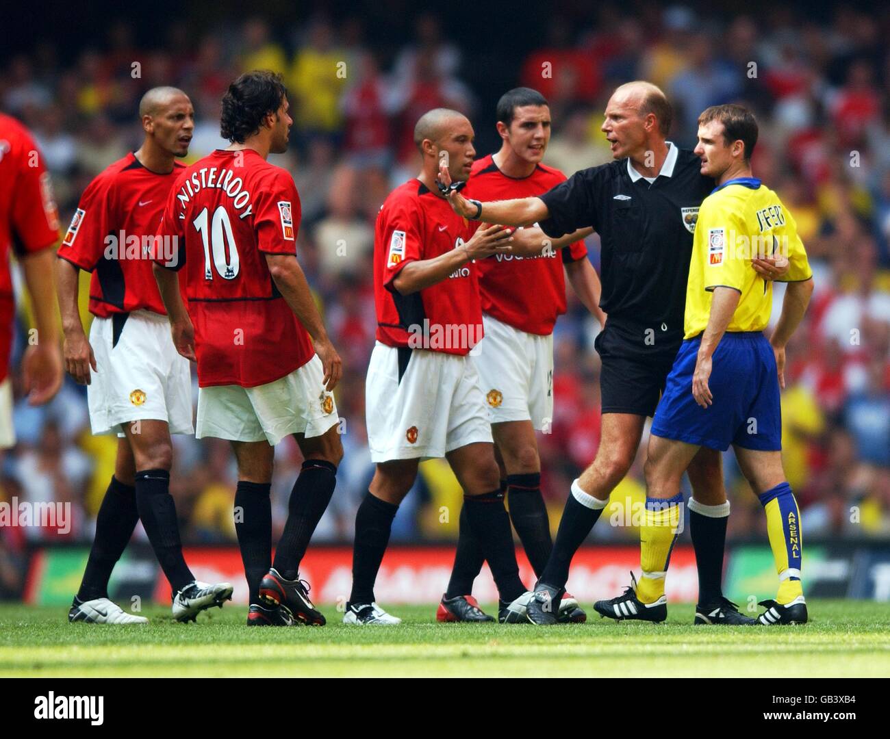 Football players argue at referee hi-res stock photography and images ...