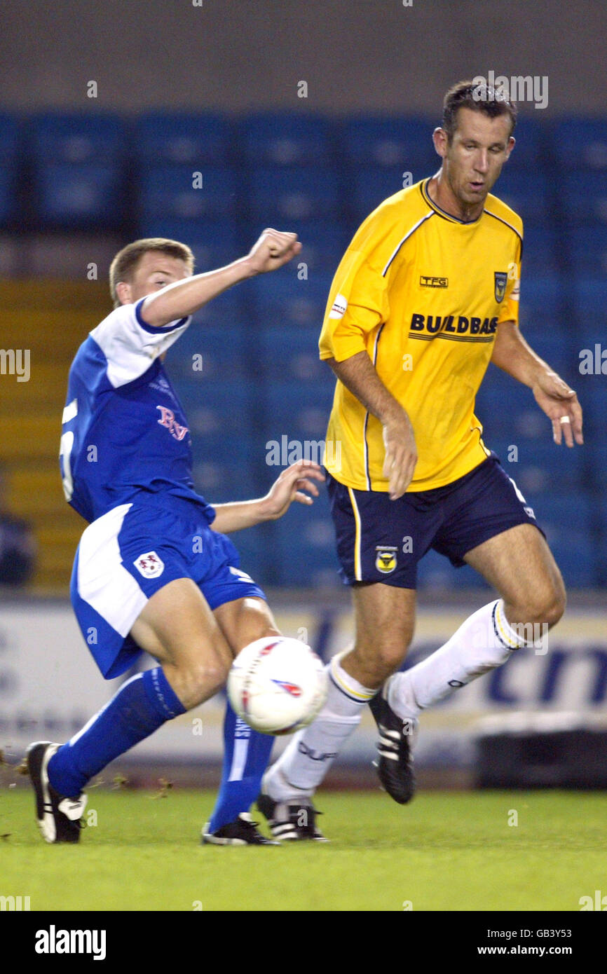 Millwall's Tony Craig and Oxford United's Derek Townsley battle for the ...
