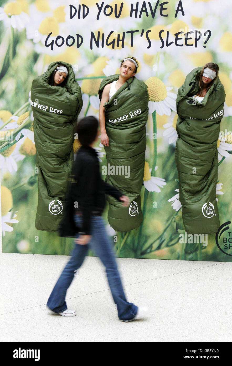 Three people catch up on their sleep as they hang suspended from a ...