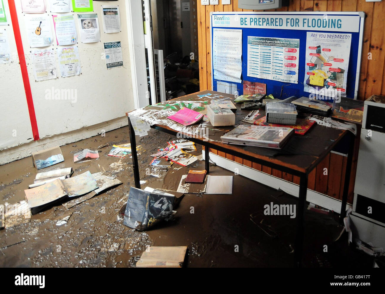 A sign displaying 'Be prepared for flooding' inside the flood damaged ...