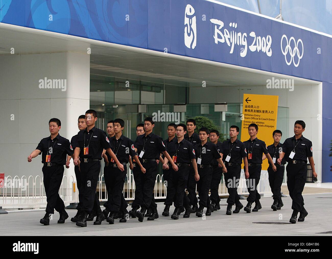 Chinese elite police soldiers march outside the National Aquatic Centre ...