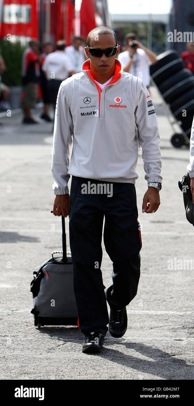 McLaren Mercedes' Lewis Hamilton arrives during the Paddock Day at ...
