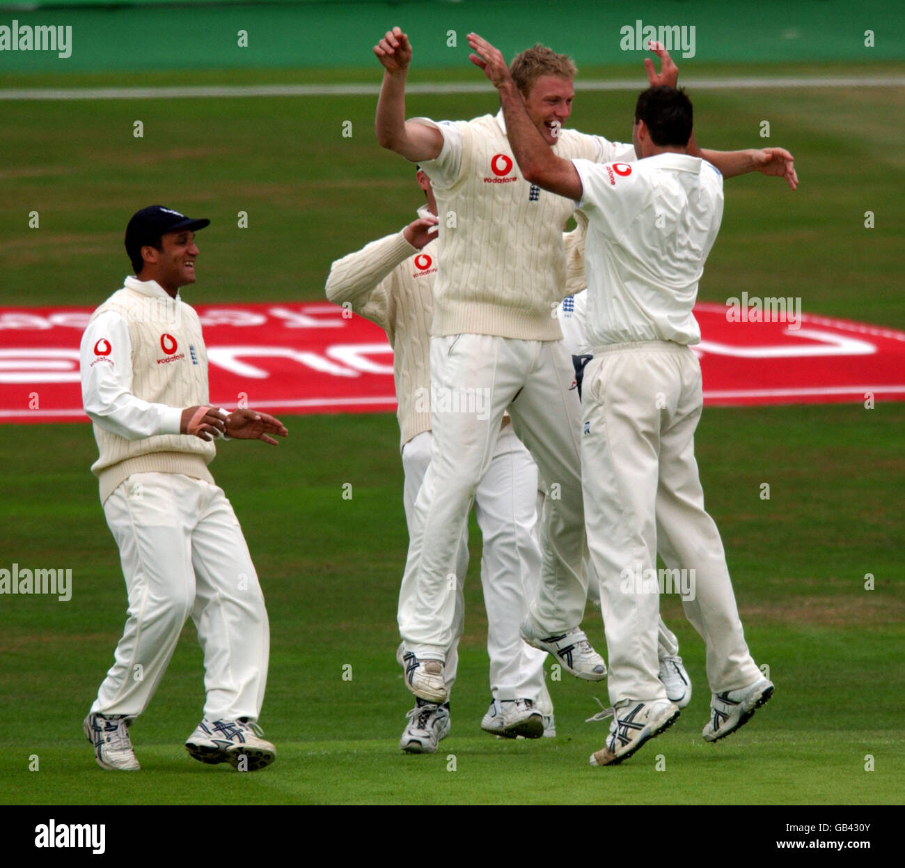 l-r; England's Mark Butcher and Andrew Flintoff congratulate Martin ...