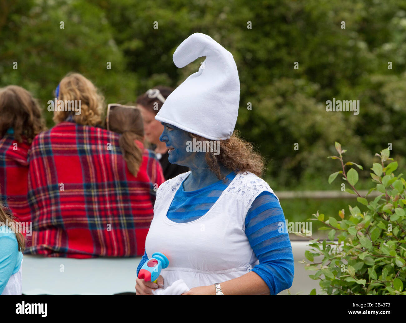 Woman dressed as a Smurf for a carnival parade Stock Photo - Alamy