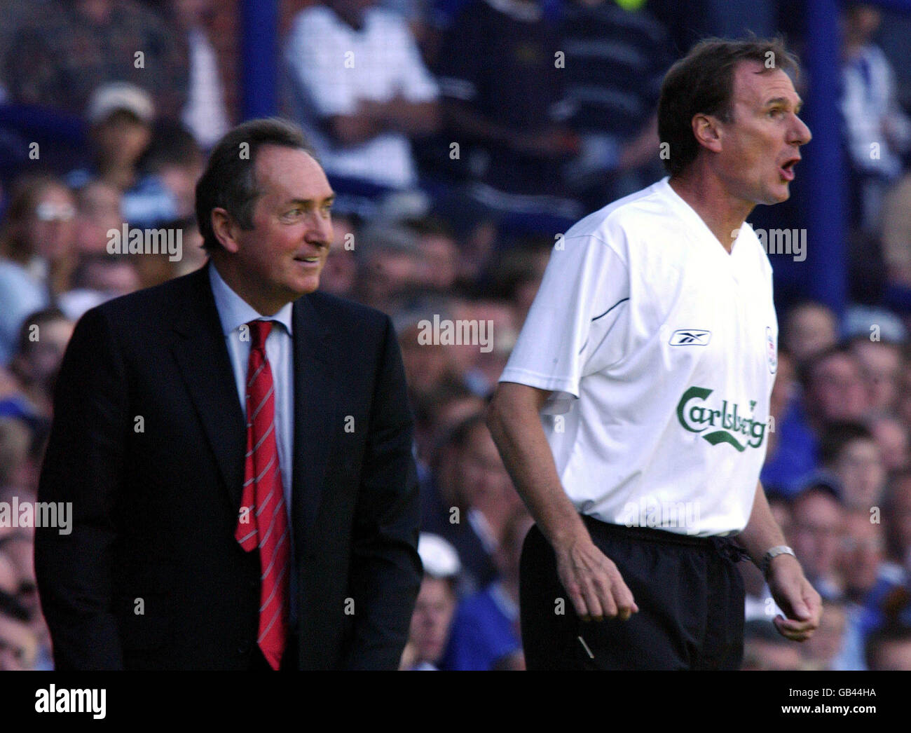 l-r; Liverpool Manager Gerard Houllier affords himself a rare smile as ...