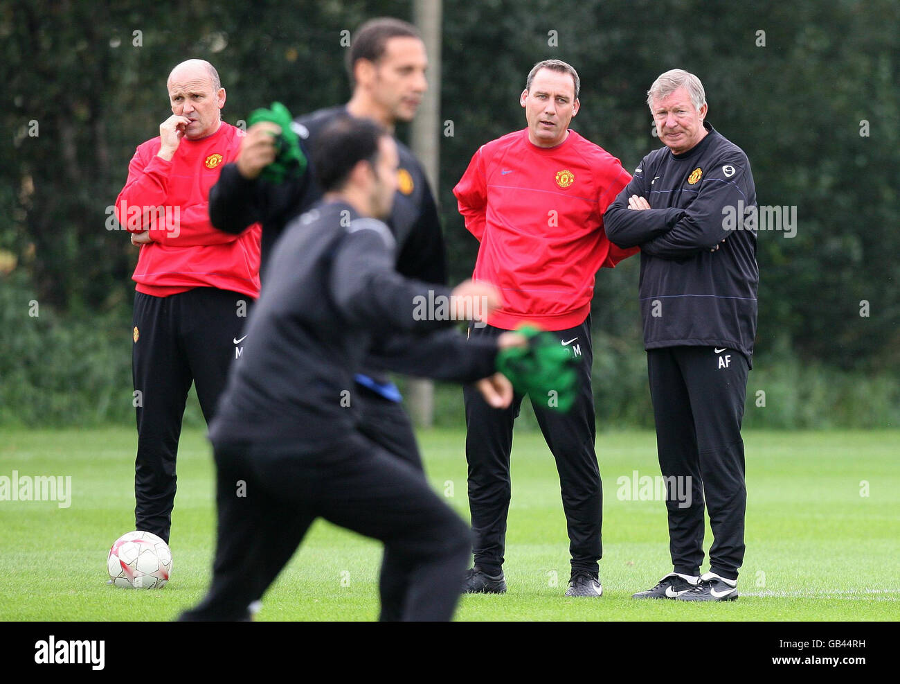 Manchester United's manager Alex Ferguson with coaches Rene Meulensteen ...