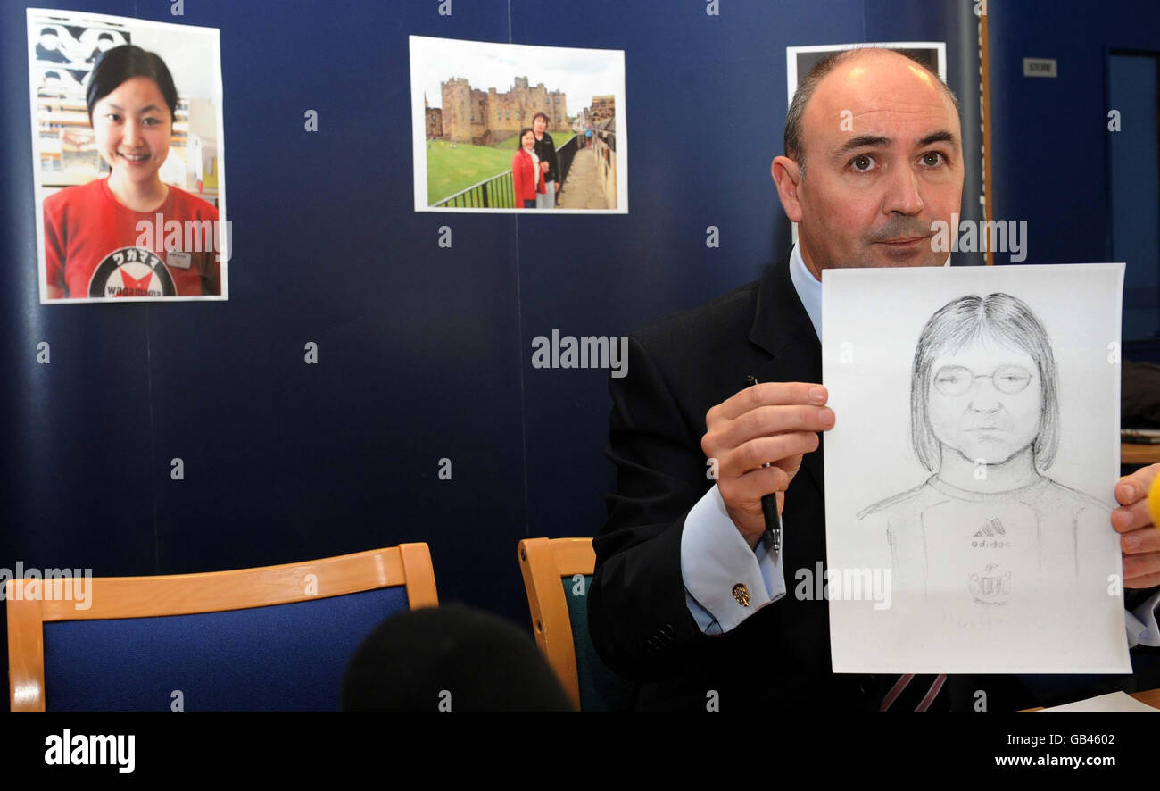 Detective superintendent Steve Wade holds up a photo fit of a suspect ...