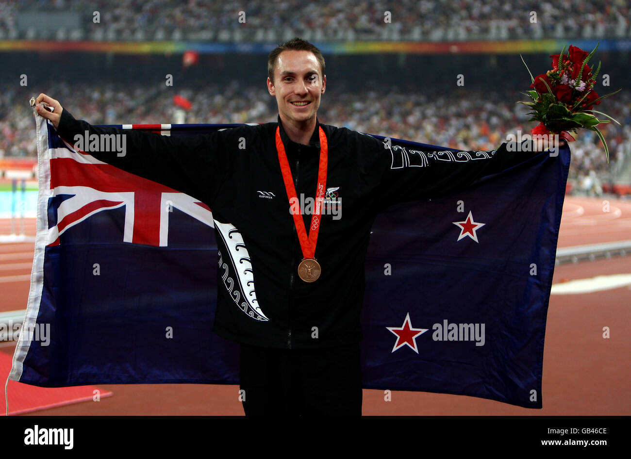 New Zealand's Nicholas Willis celebrates after receiving his bronze ...