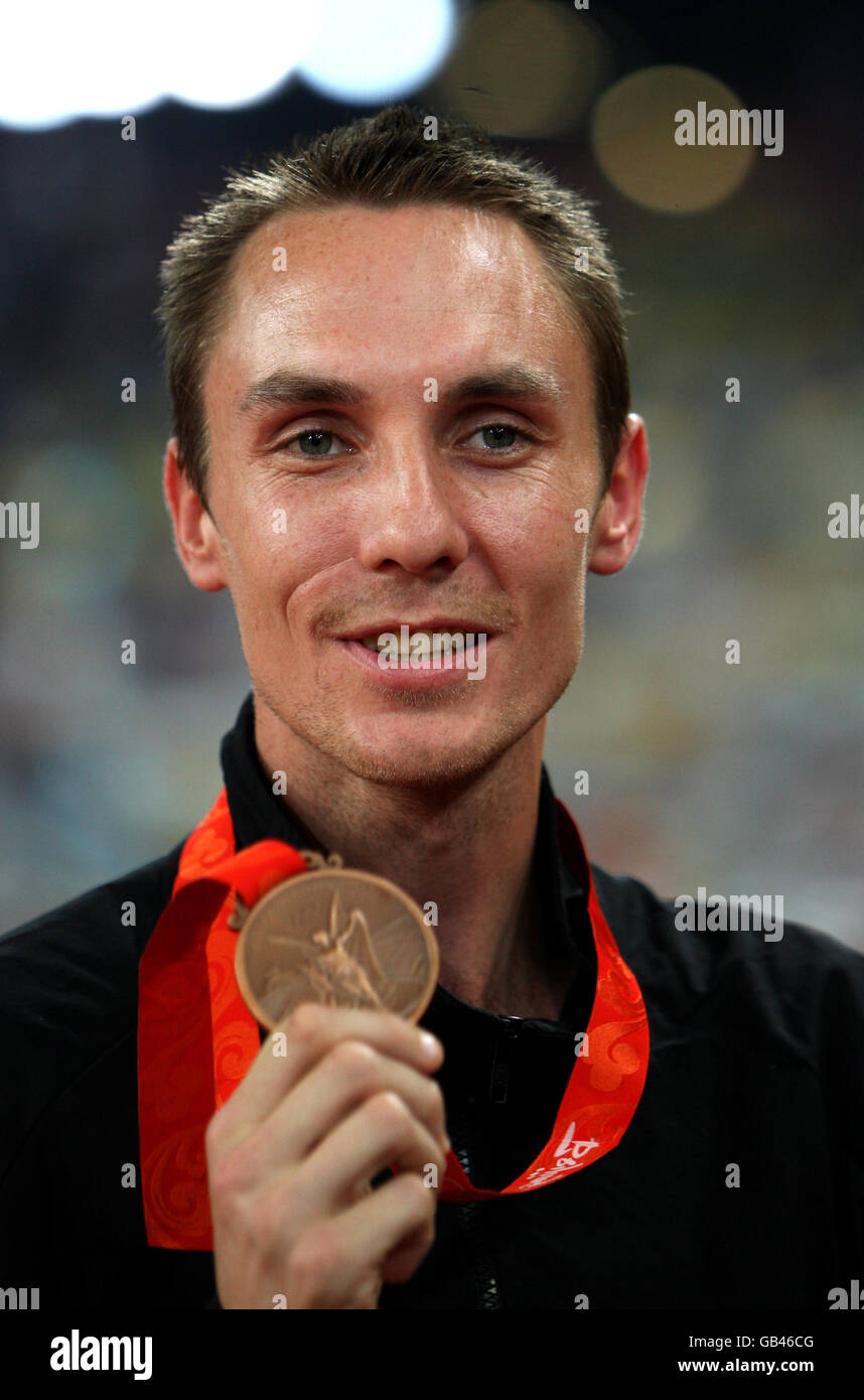 New Zealand's Nicholas Willis celebrates after receiving his bronze ...