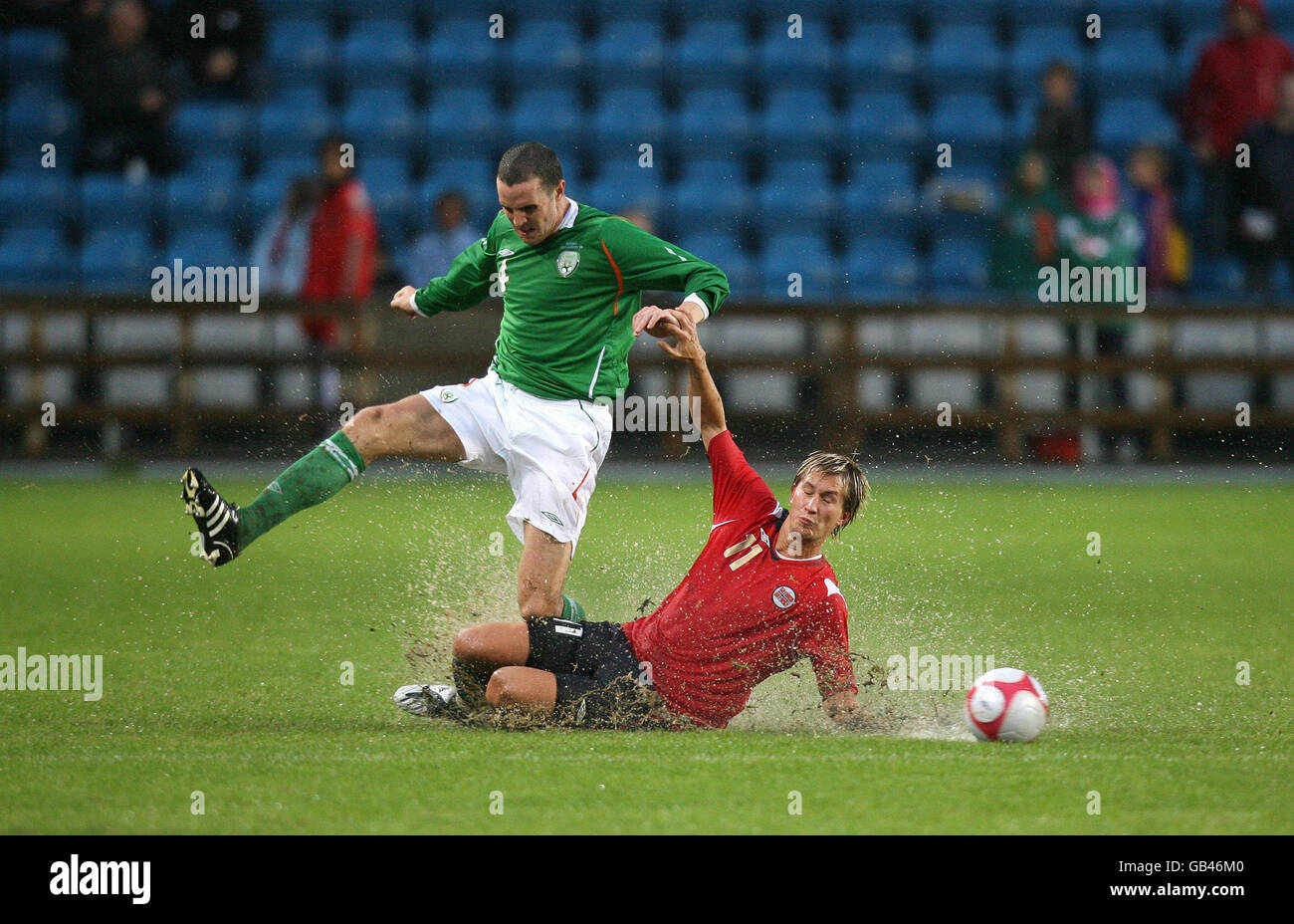 Republic of Ireland's John O'Shea (left) battles with Norway's Morten ...
