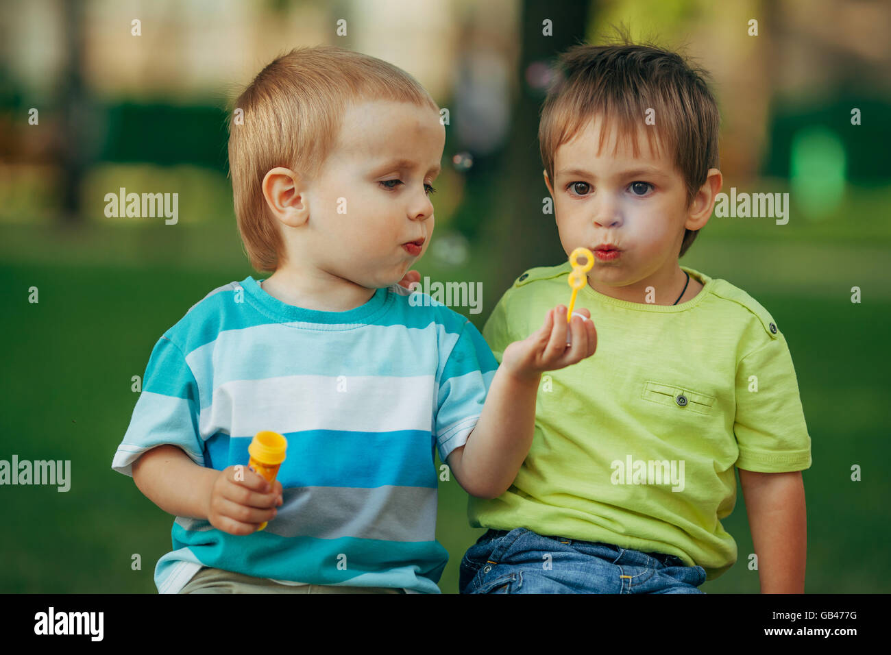 little boys playing with bubbles Stock Photo - Alamy