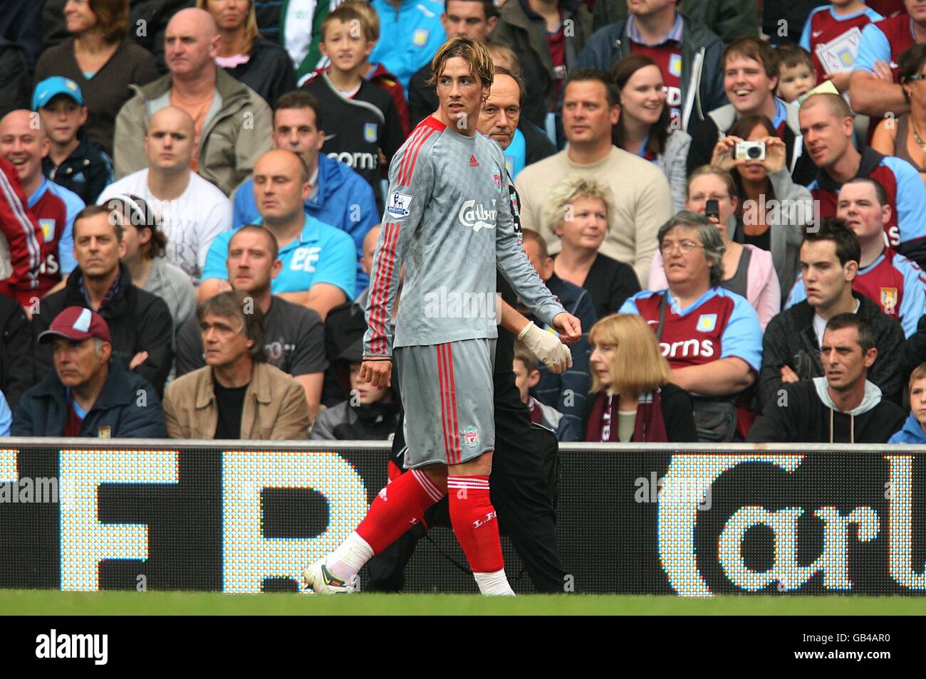 Liverpools fernando torres walks off field hi-res stock photography and ...