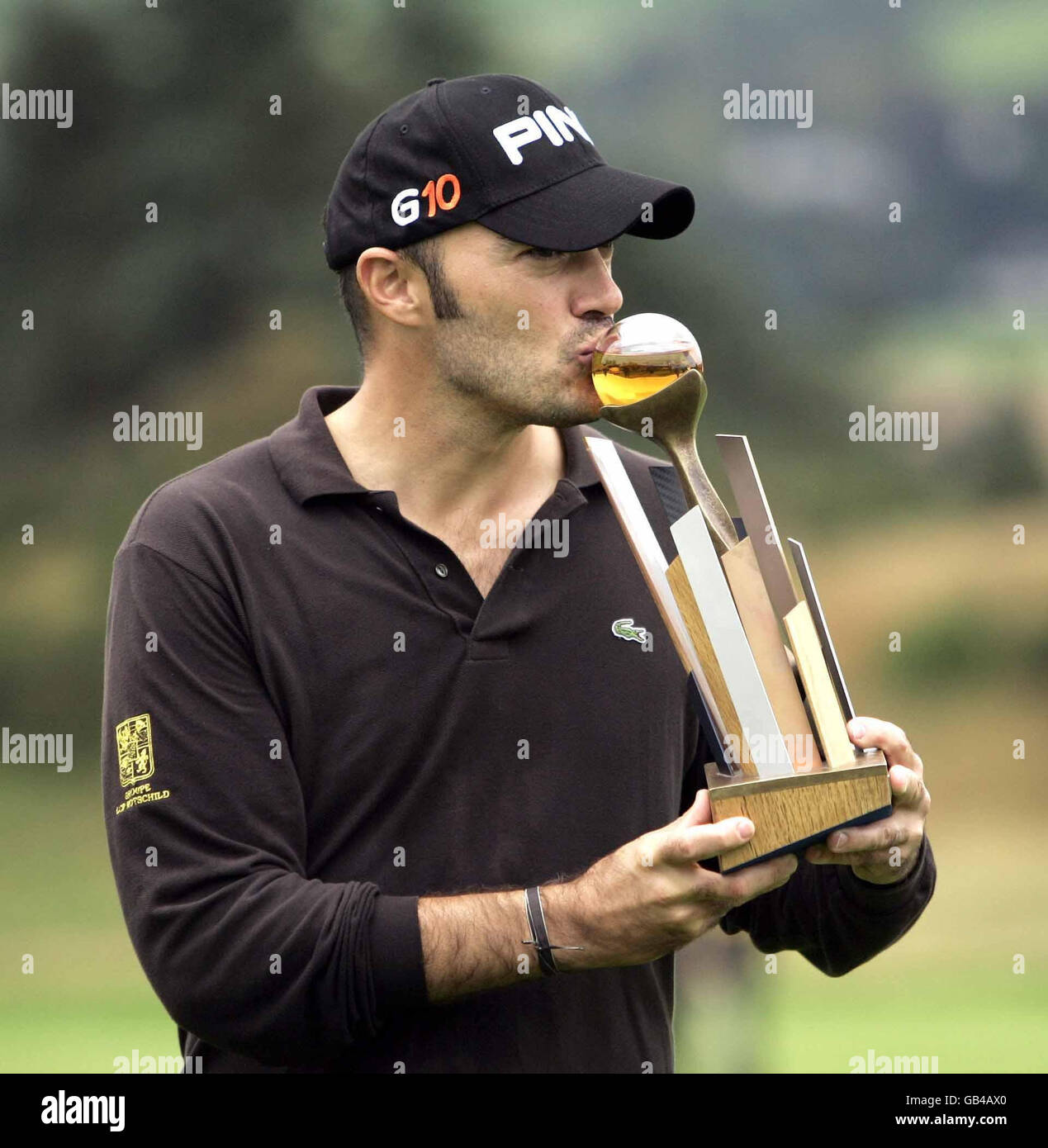 Gregory Havret celebrates with his trophy following Round Four of the ...