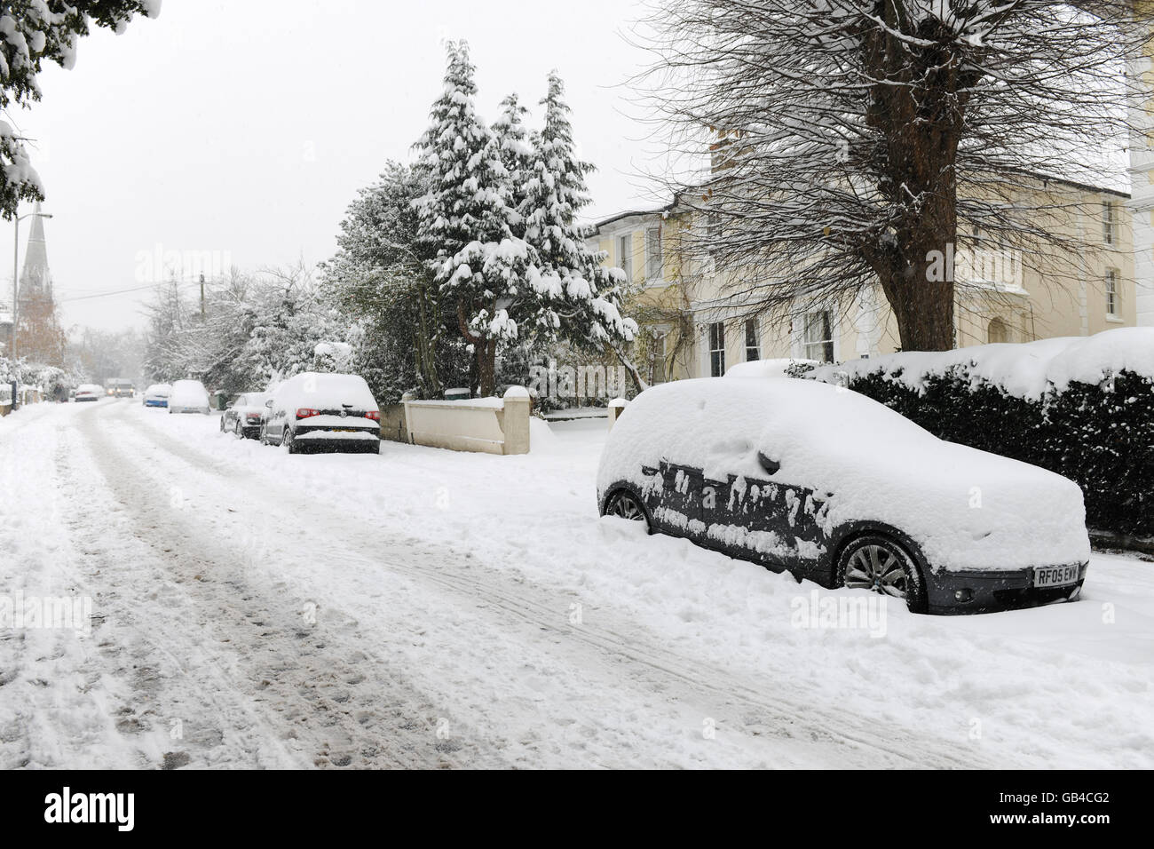 Cars covered in deep snow parked alongside a street in Tunbridge Wells ...