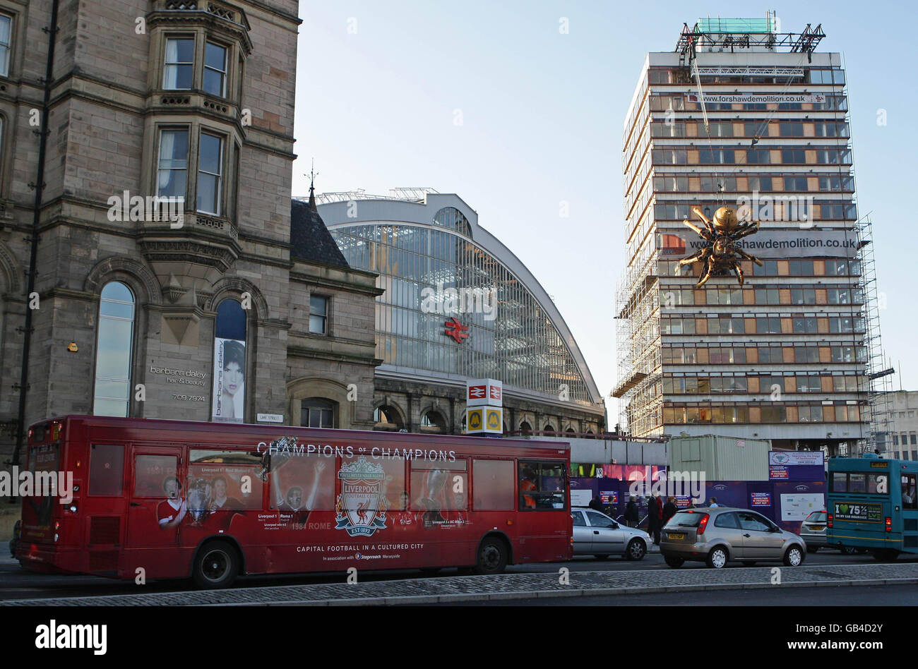 A giant spider hangs from the side of the Concourse Tower in Liverpool ...