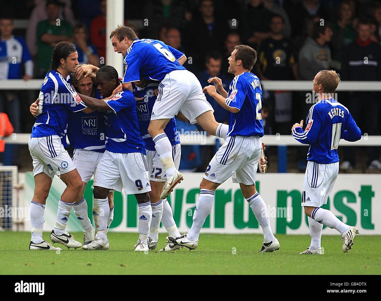 Peterborough's Craig Mackail-Smith (2nd left) is congratulatd by his ...