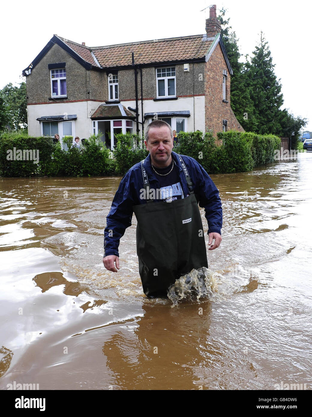 Man name known wades through flood water near pickering hi-res stock ...
