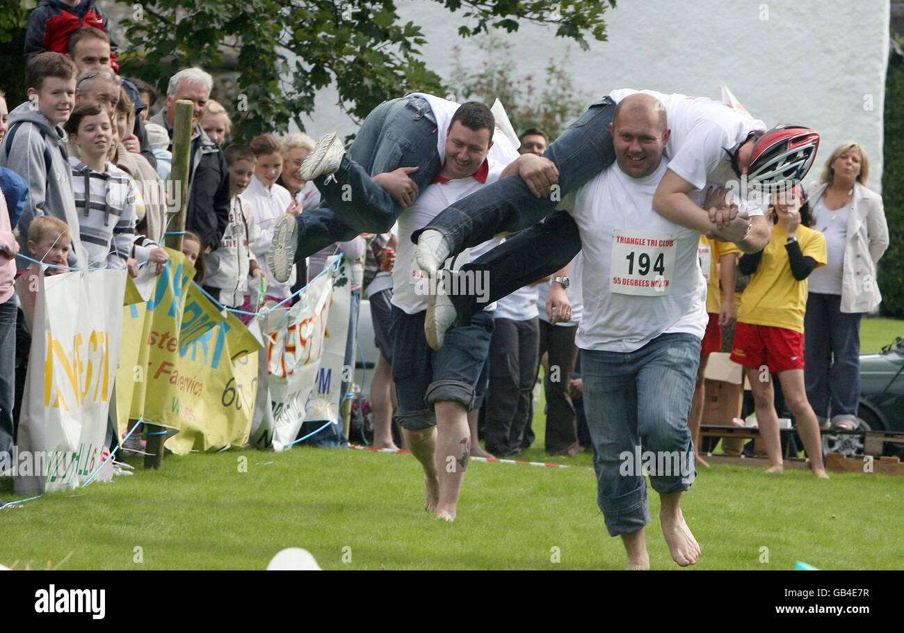 Joe Linton carrying Alison Moore (right) from Limavady Co Londonderry ...