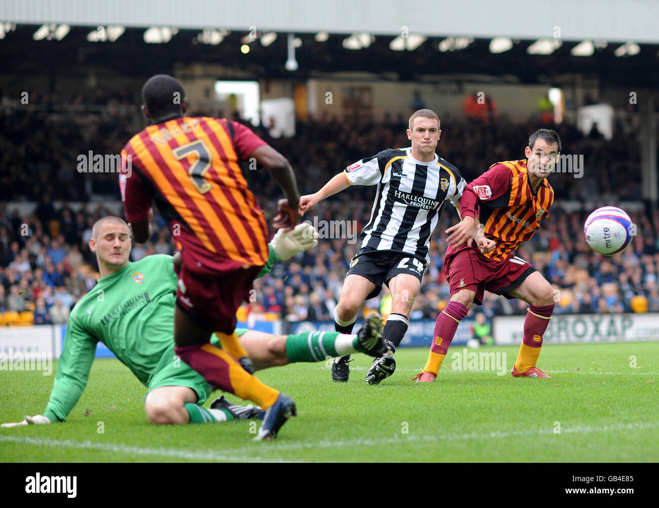 Port Vale's goalie Joe Anyon saves from Bradford City's Omar Daley as ...