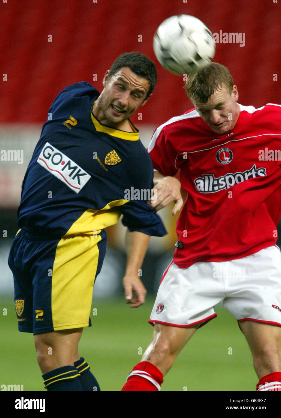 Wimbledon's Scott McDonald and Charlton Athletic's Mark Ricketts battle ...