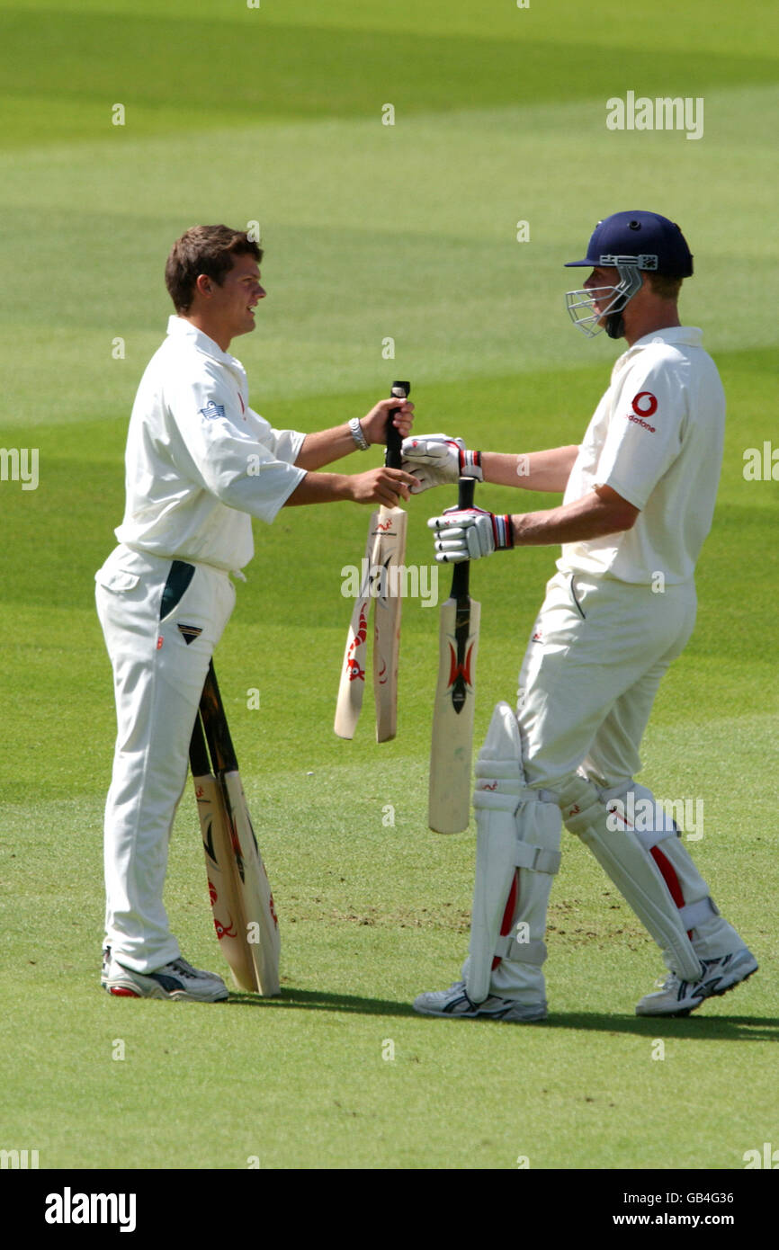 England's Andrew Flintoff (r) gets his broken bat changed Stock Photo ...