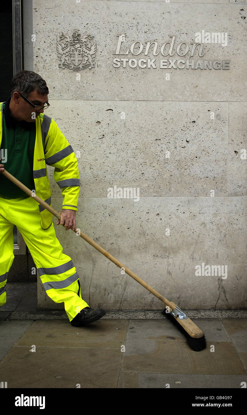City market. A street cleaner clears up the mess outside the London ...