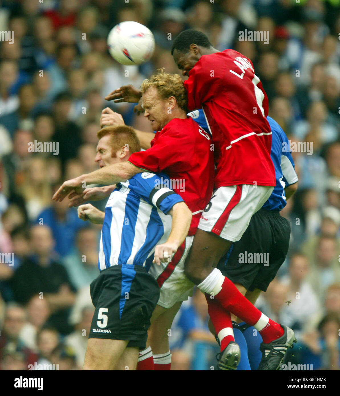 Dennis Lawrence jumps the highest to score the first goal for Wrexham ...