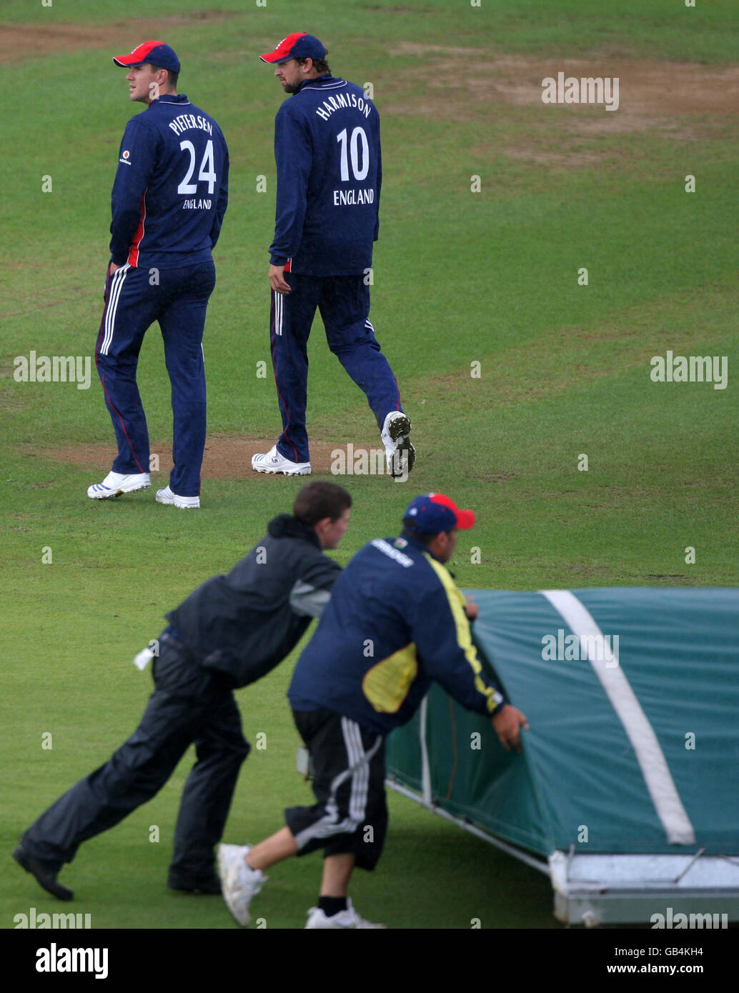 England captain Kevin Pietersen and Steve Harmison walk off the pitch ...