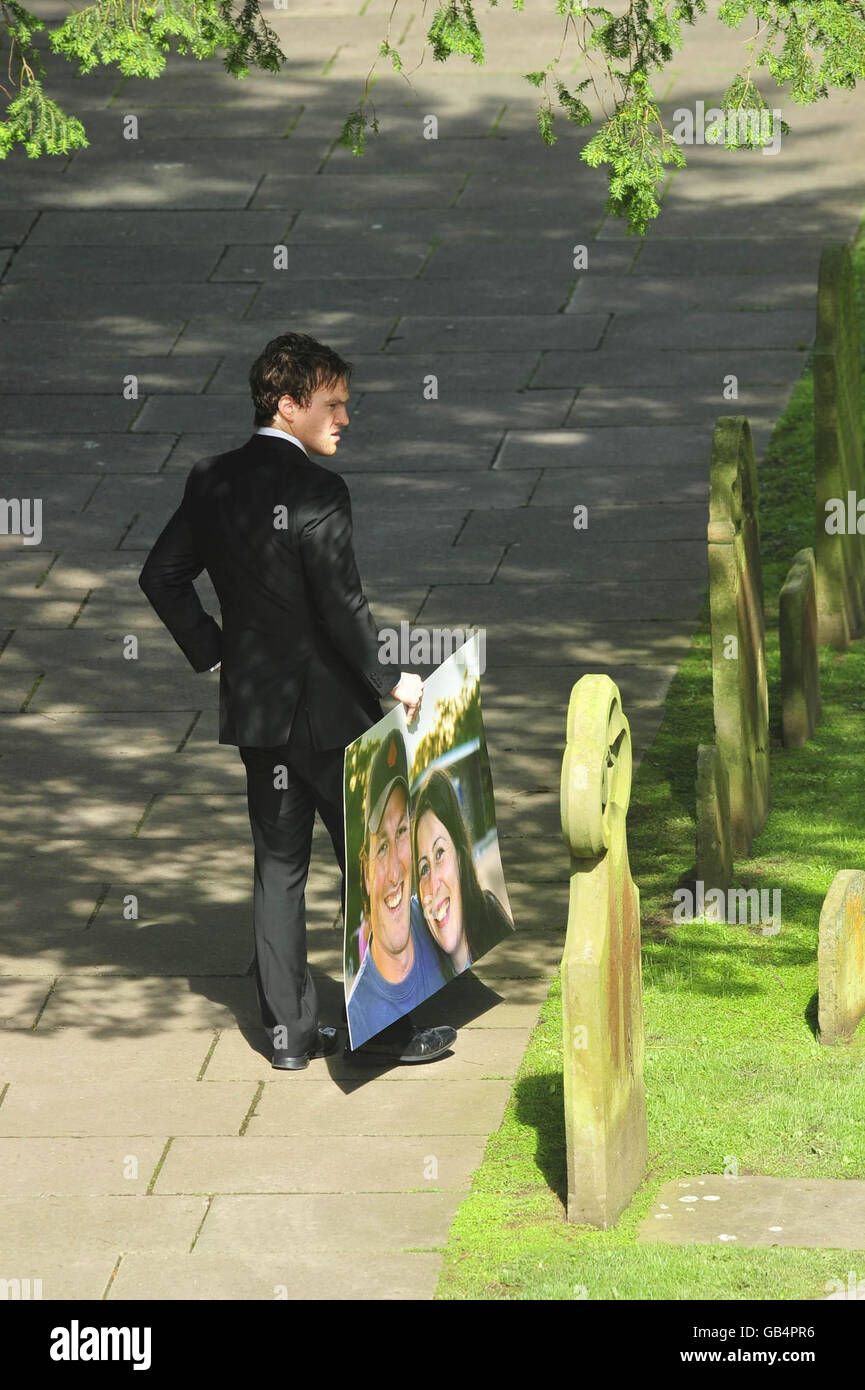 Ben Mullany's brother Adam, carries a picture of Catherine and Ben ...