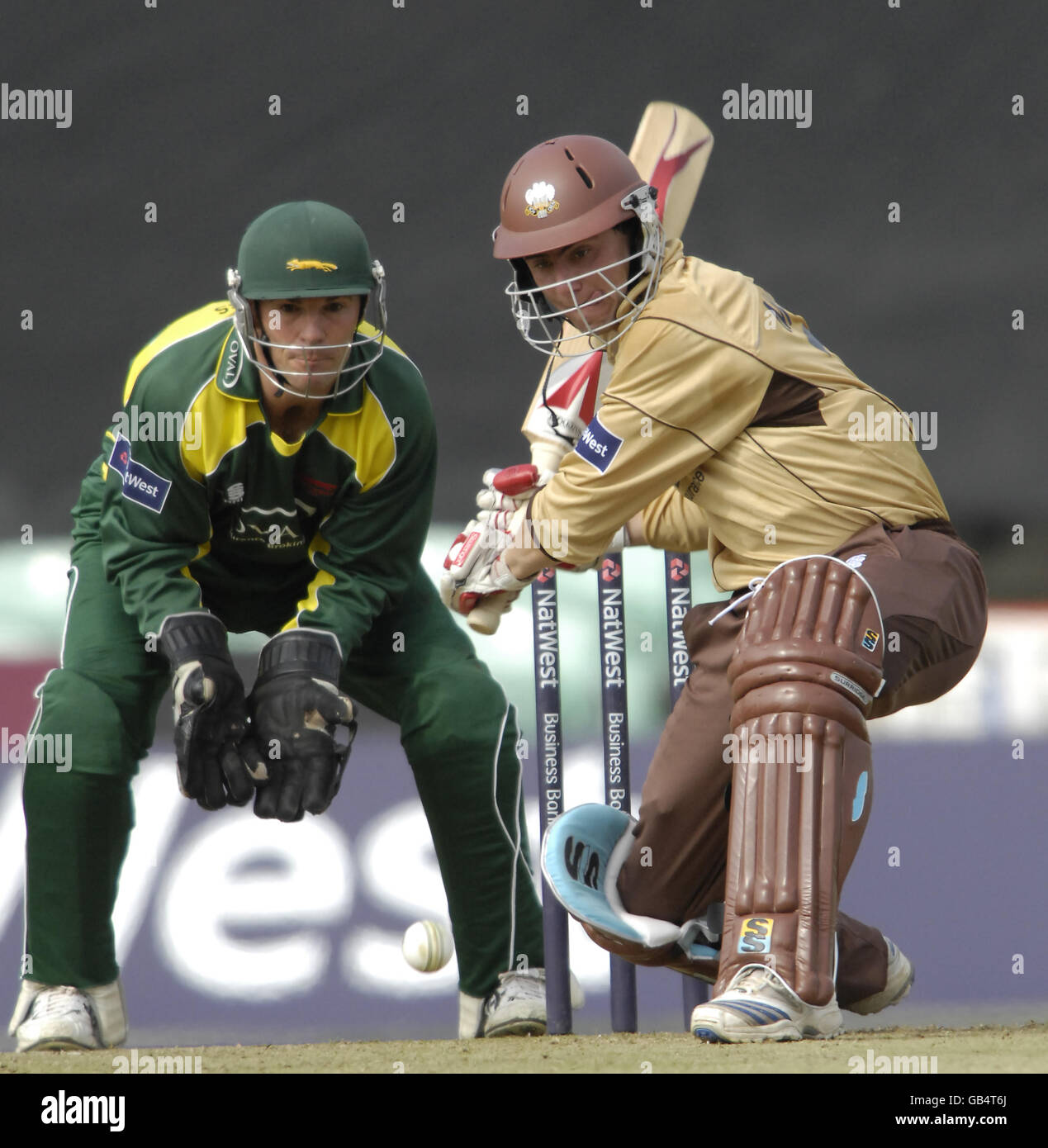 Surrey Brown Caps' Chris Murtagh and Leicestershire Foxes' Paul Nixon ...