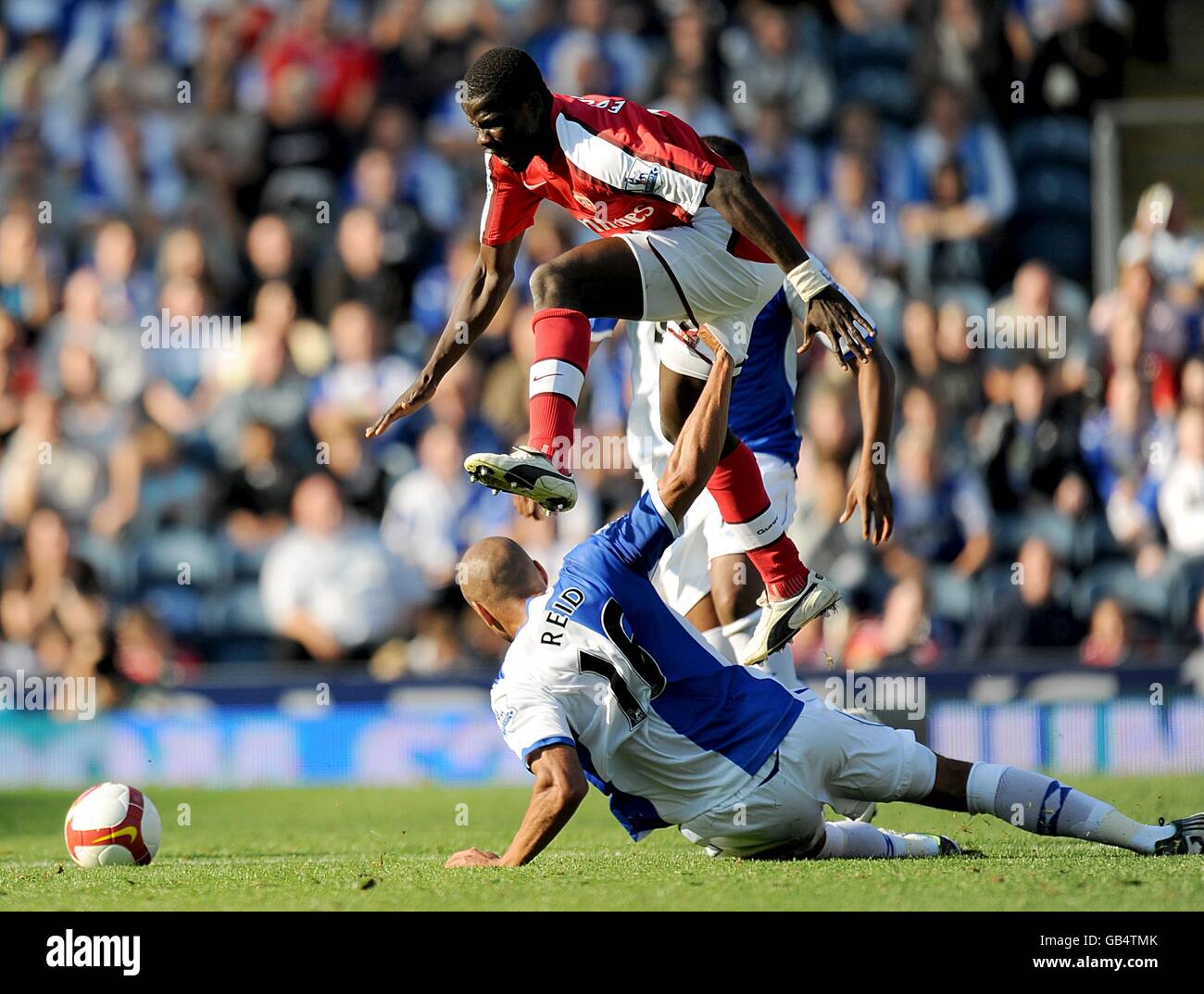 Blackburn Rovers' Steven Reid and Arsenal's Emmanuel Eboue in action ...