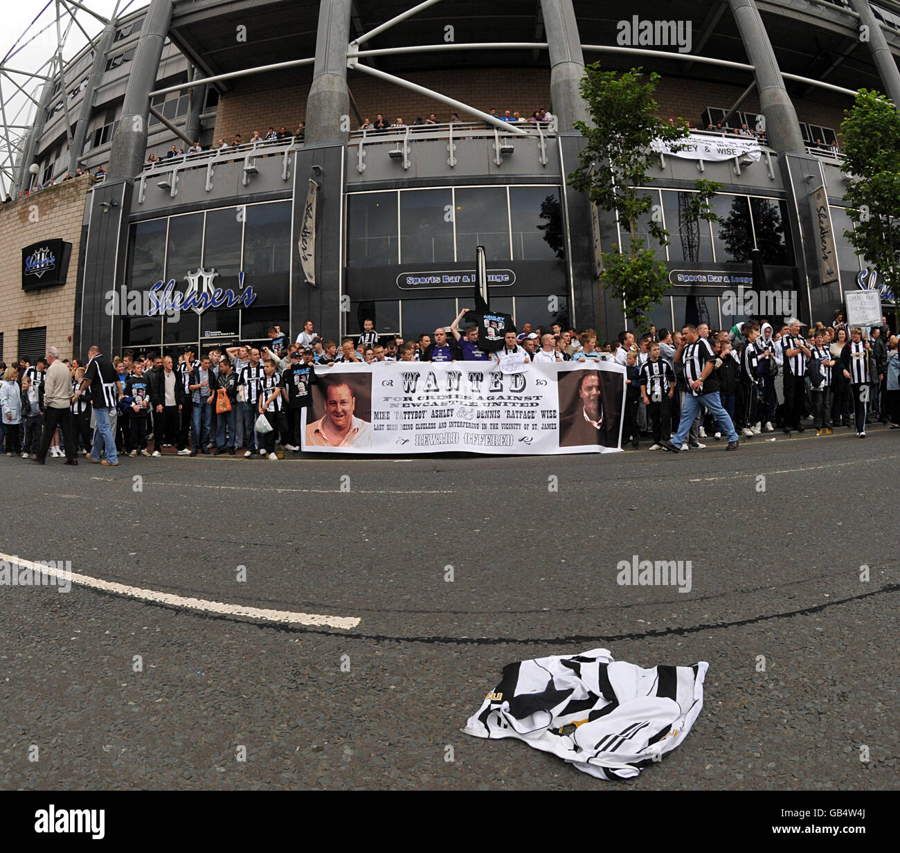 A Newcastle United shirt lies in the road as fans protest outside St ...