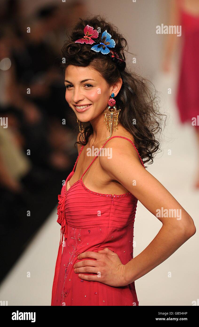 A model wears a creation by designer Caroline Charles, during London ...