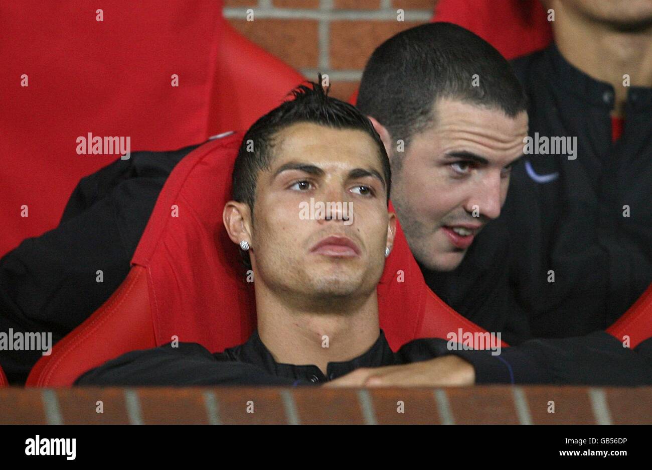 Manchester United's Cristiano Ronaldo sits on the bench with team mate ...