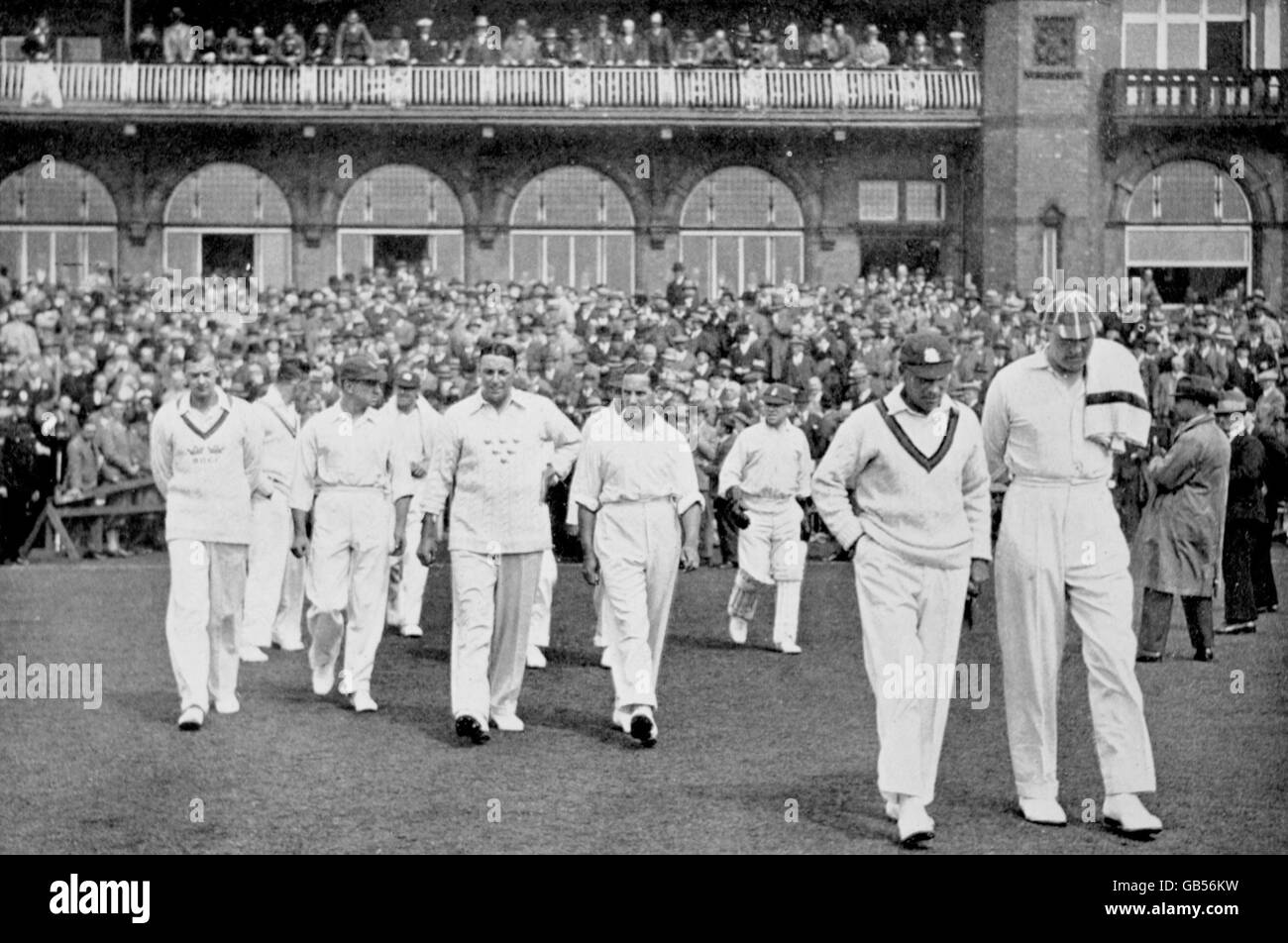 The England team walk out into the field for the first day's play Stock ...