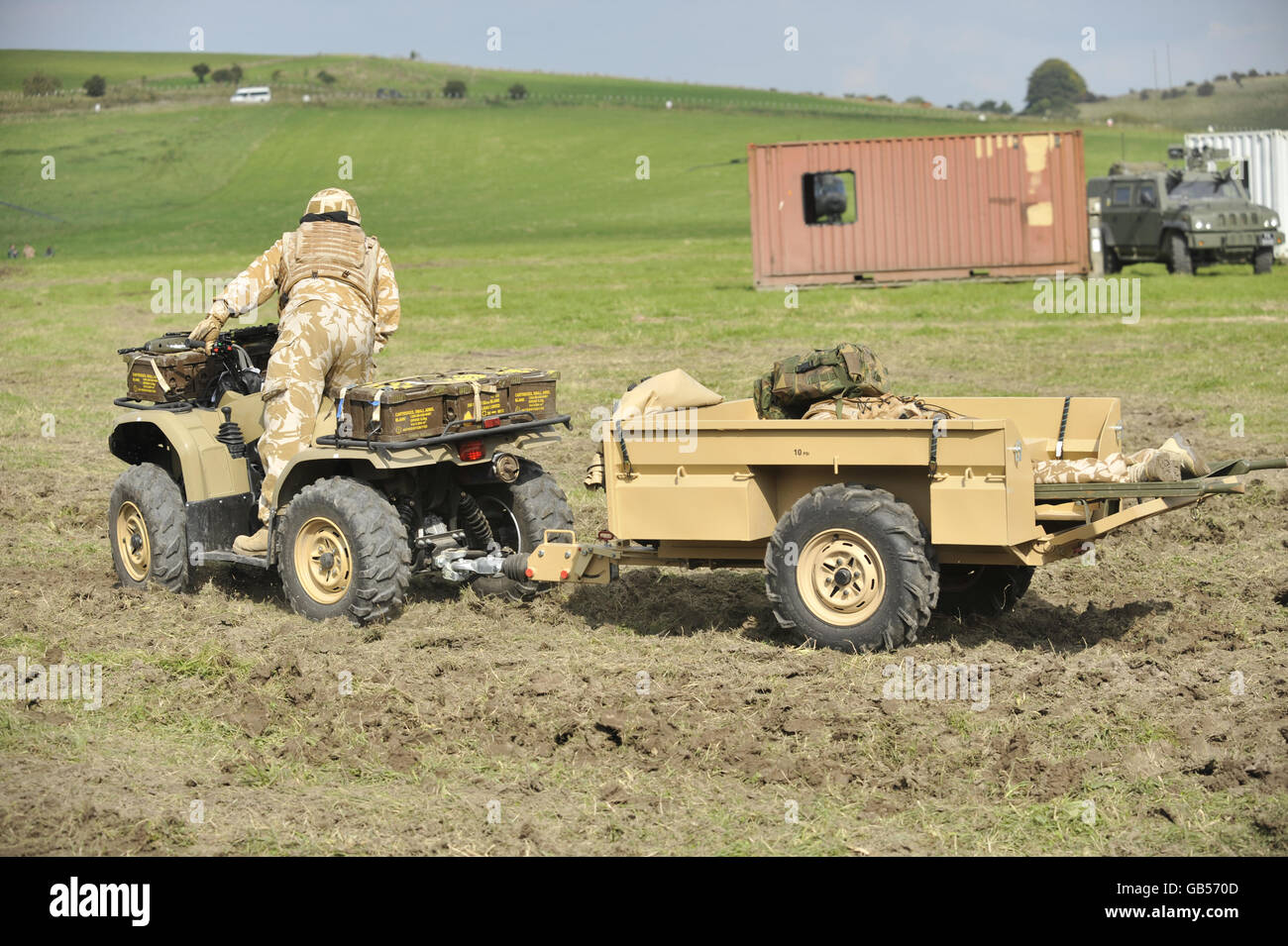 During an exercise a soldier is loaded onto a trailer attached to a ...