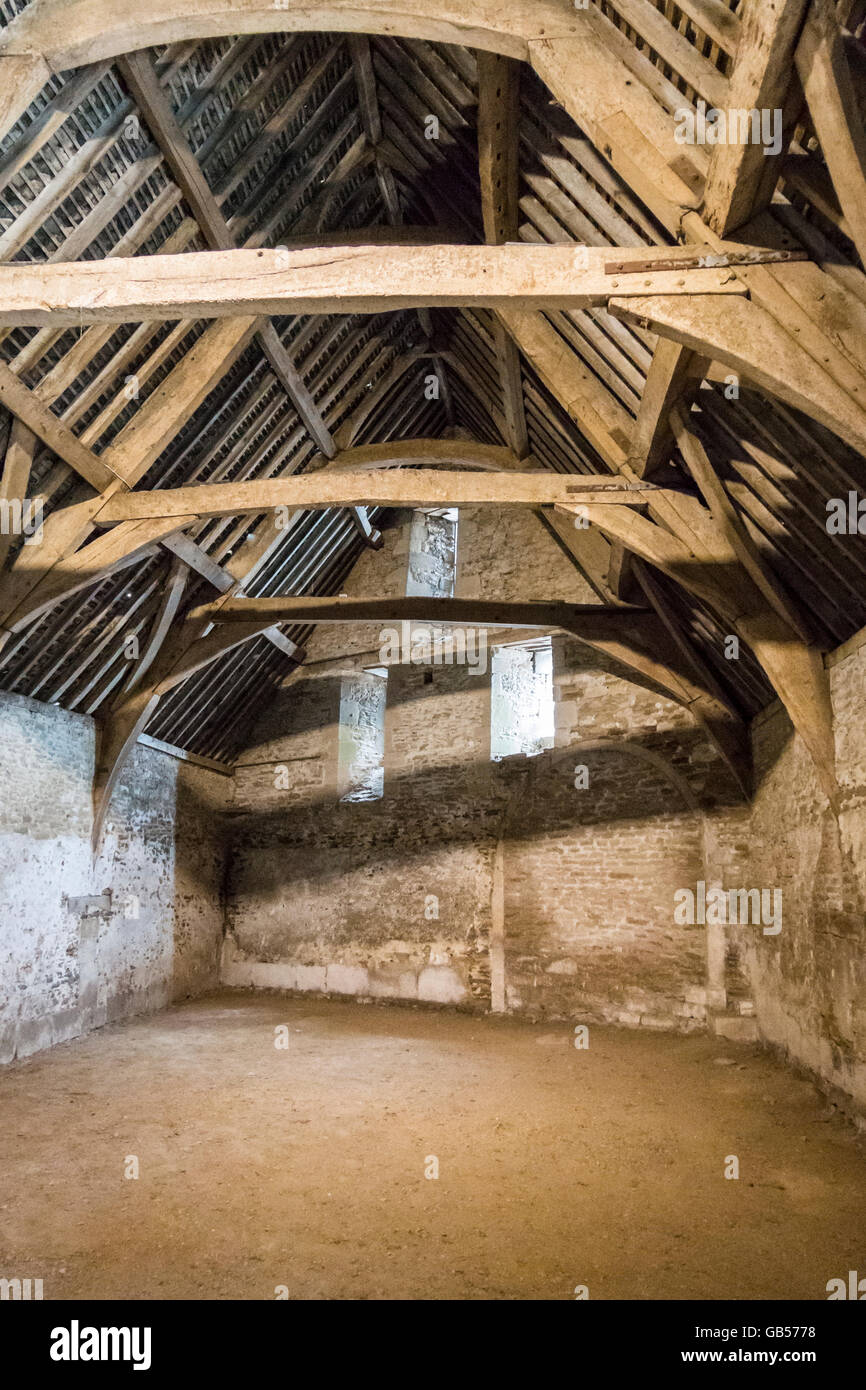 Interior of a medieval tithe barn in the village of Lacock, Wiltshire ...