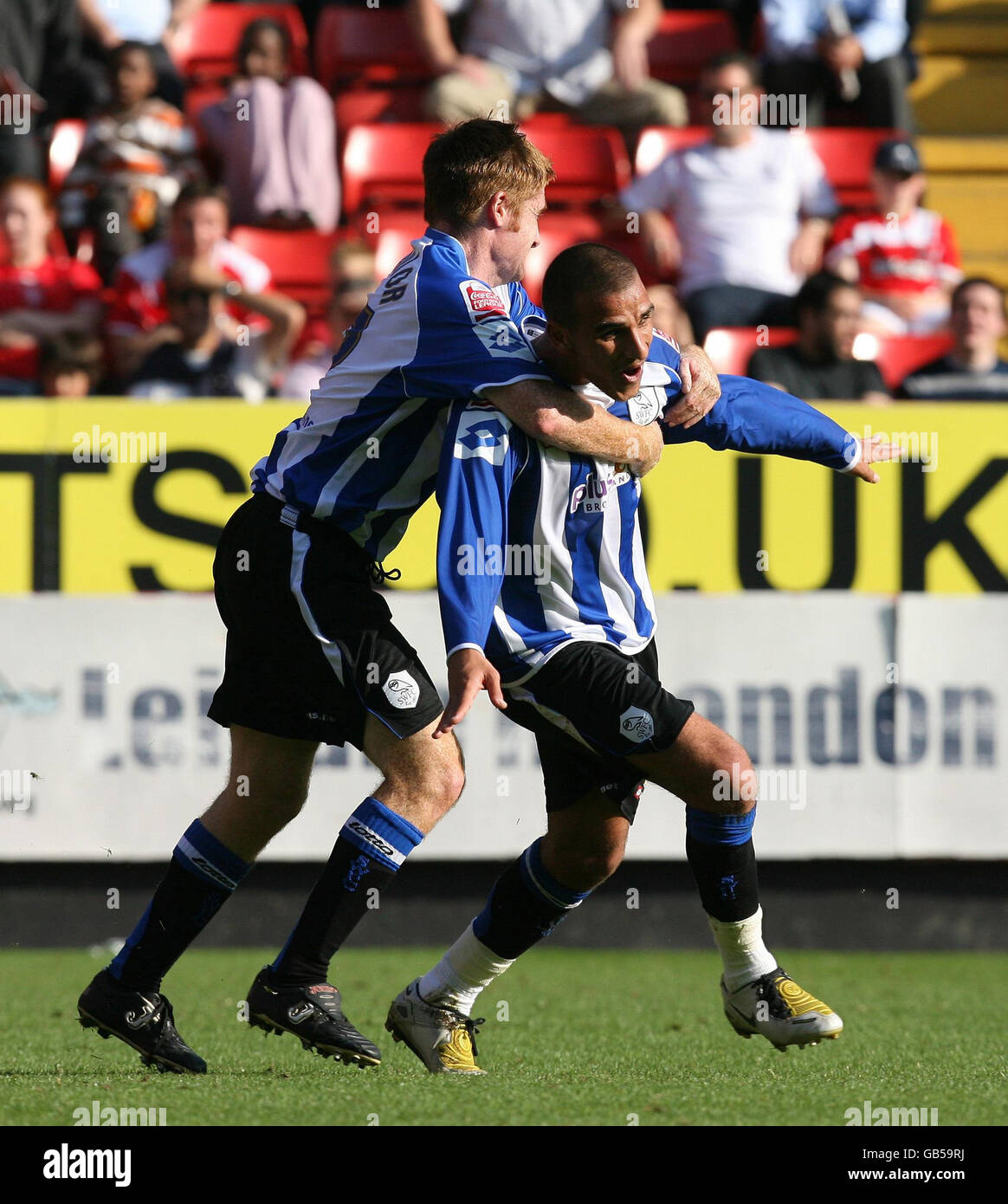 Sheffield Wednesday's Marcus Tudgay is grabbed by teammate James O ...