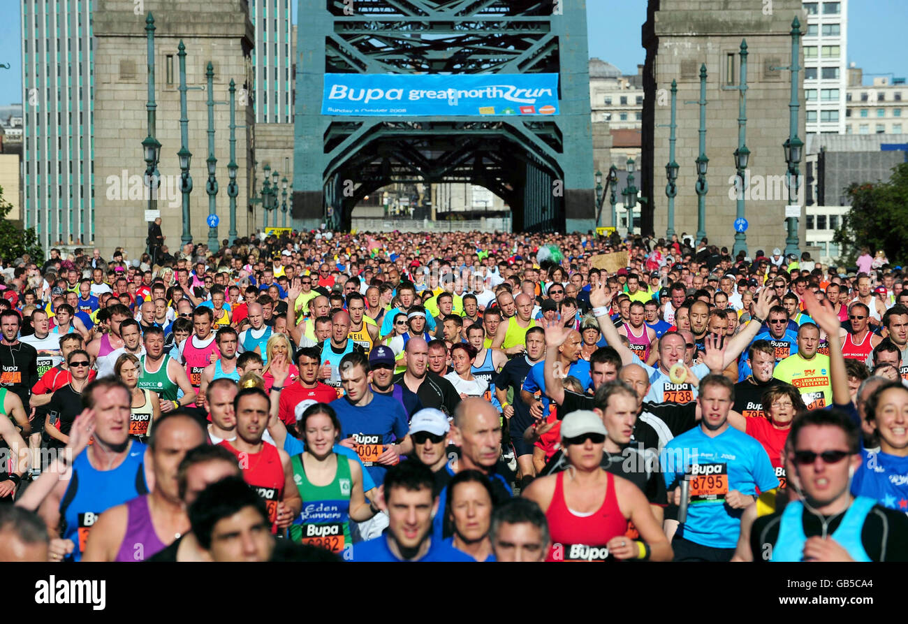 Athletics - BUPA Great North Run. Competitors make their way across the ...